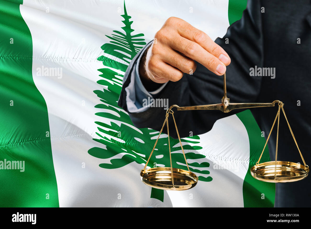 Judge Is Holding Golden Scales Of Justice With Norfolk Island Waving