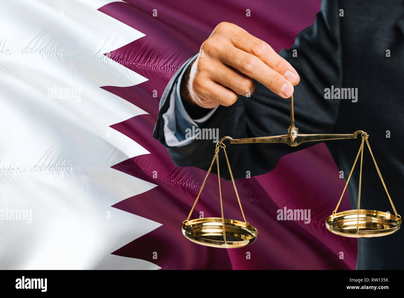 Qatari Judge is holding golden scales of justice with Qatar waving flag ...
