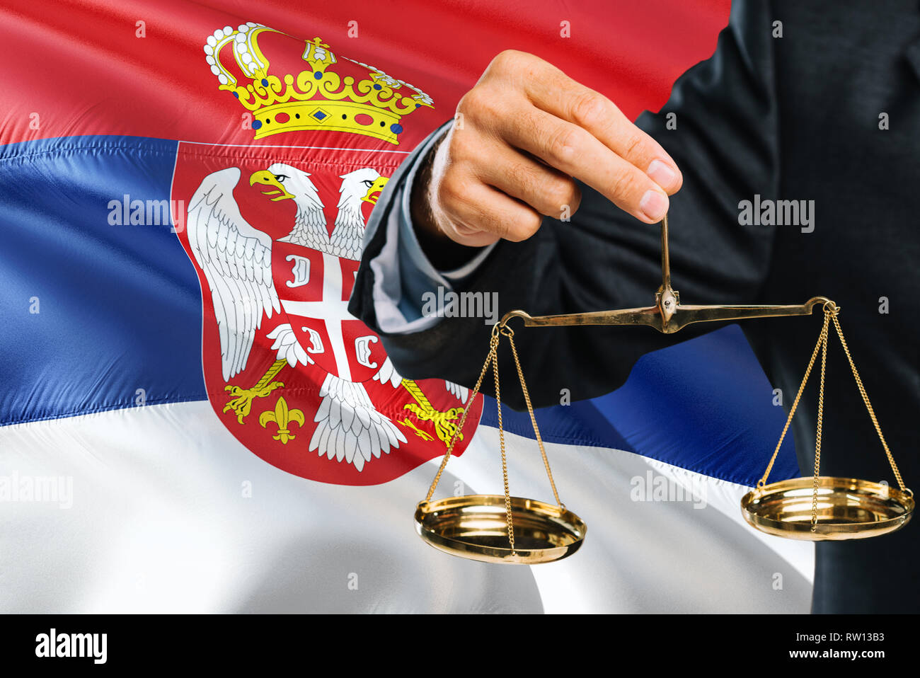 Serbian Judge is holding golden scales of justice with Serbia waving ...