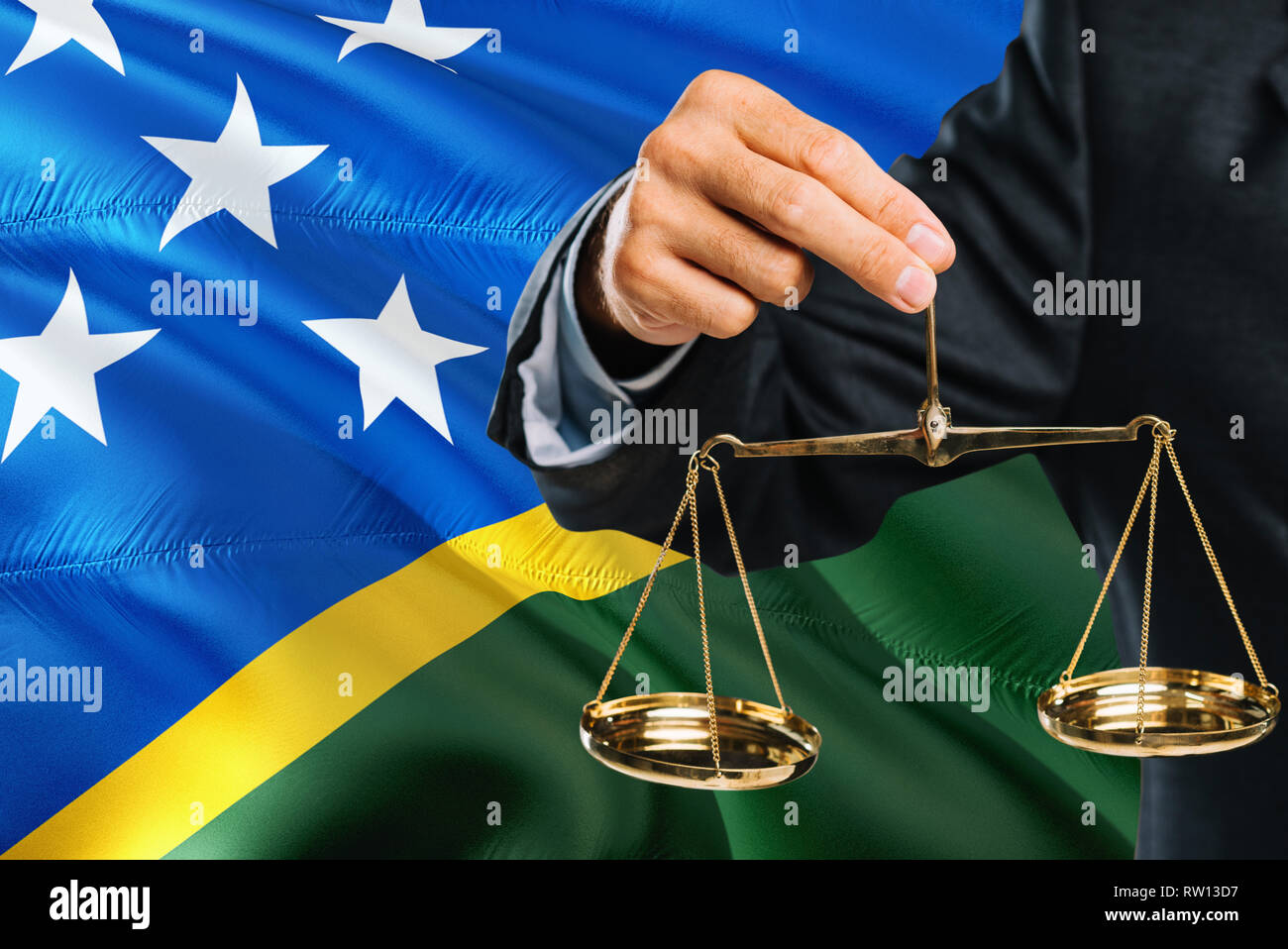 Judge is holding golden scales of justice with Solomon Islands waving ...