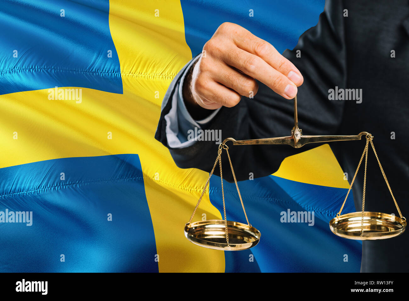 Swedish Judge is holding golden scales of justice with Sweden waving ...