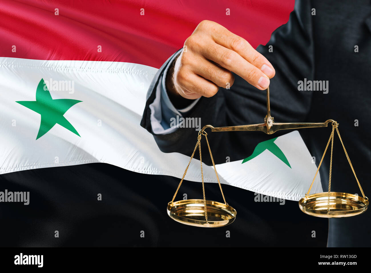 Syrian Judge is holding golden scales of justice with Syria waving flag ...
