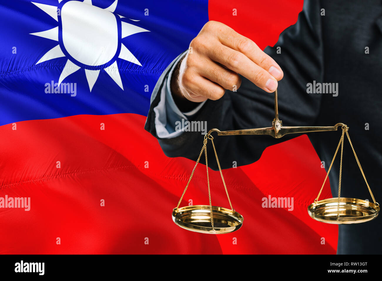 Taiwanese Judge is holding golden scales of justice with Taiwan waving ...