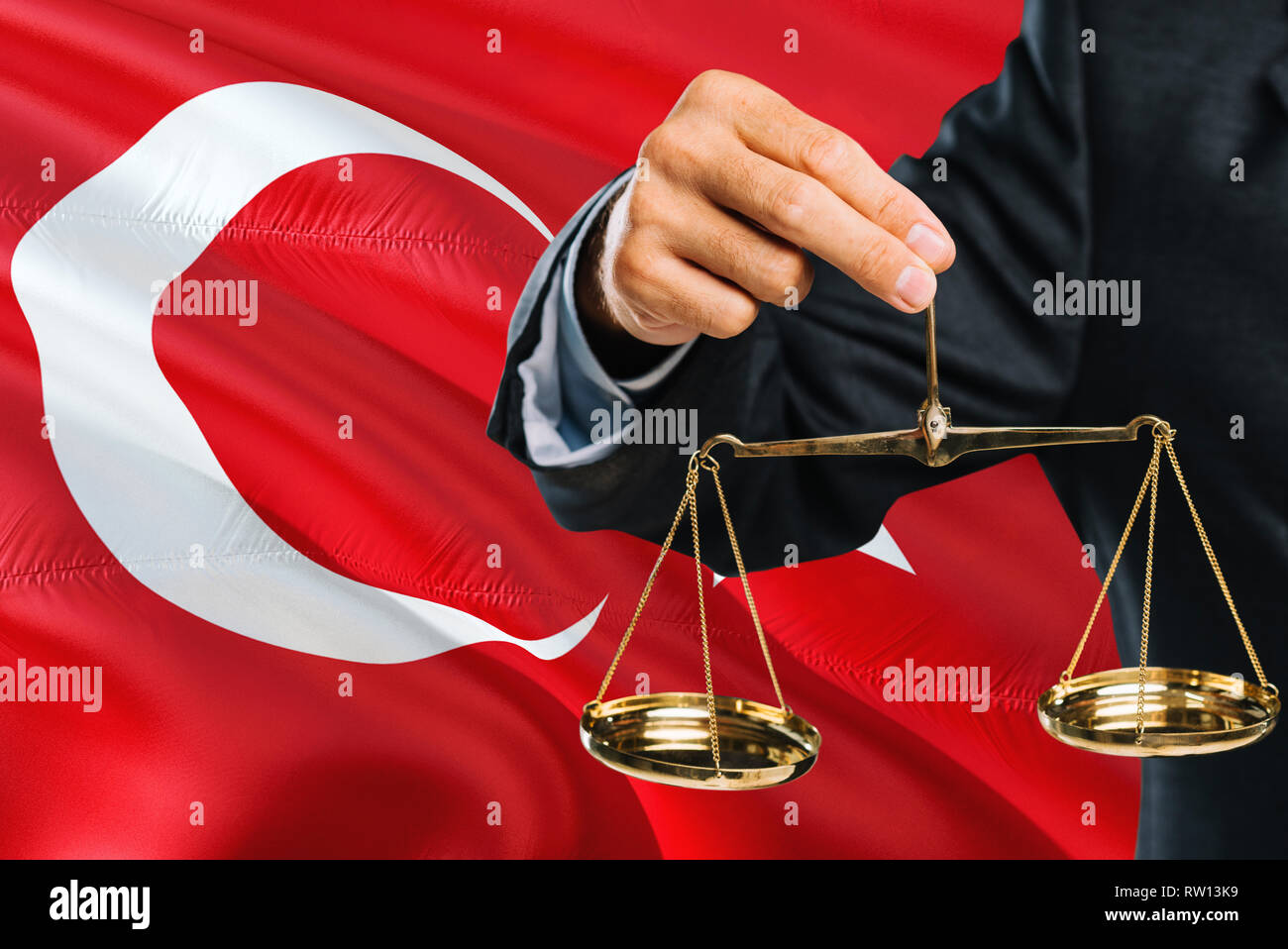 Turkish Judge is holding golden scales of justice with Turkey waving ...