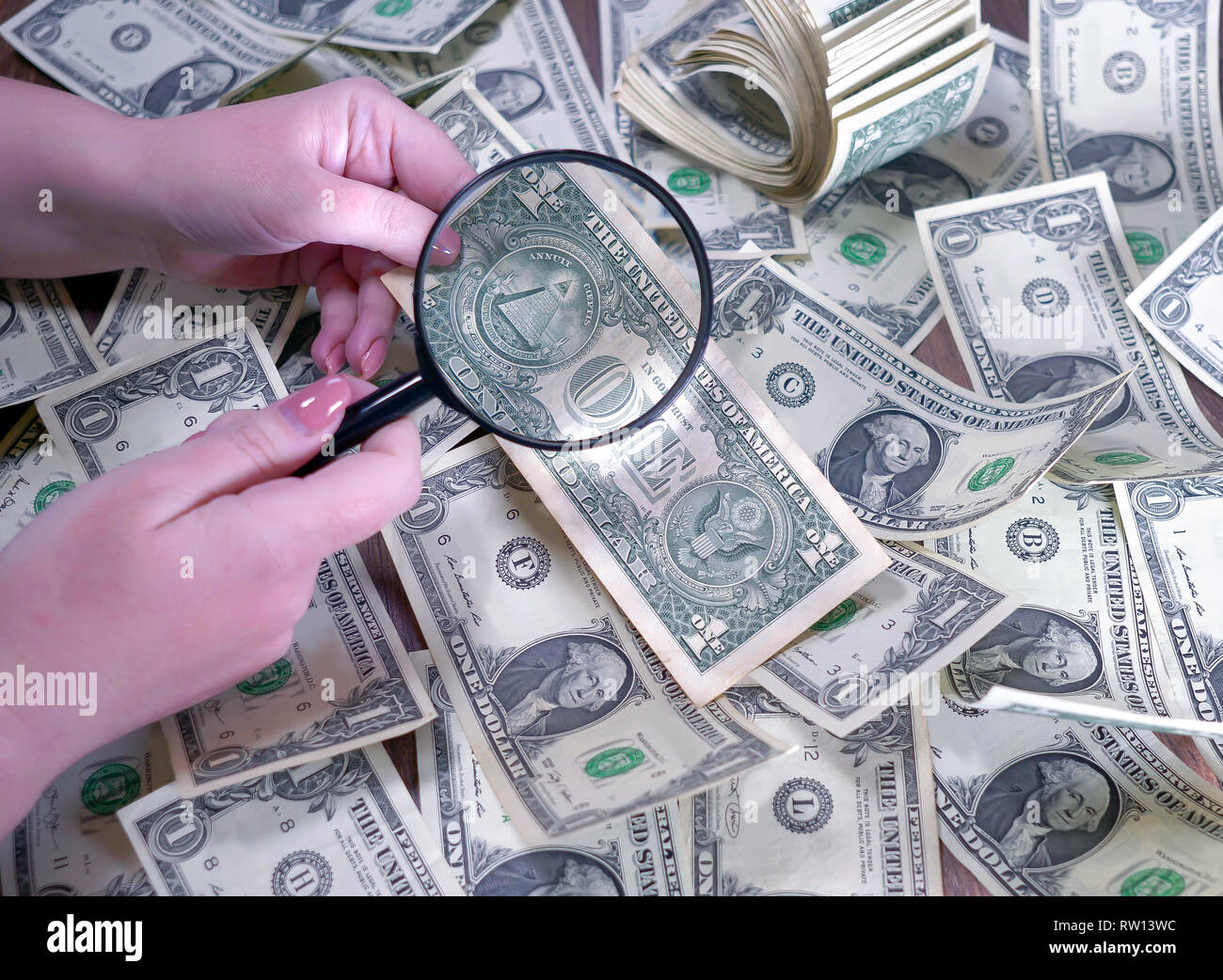 Female fingers hold magnifying hi-res stock photography and images - Alamy