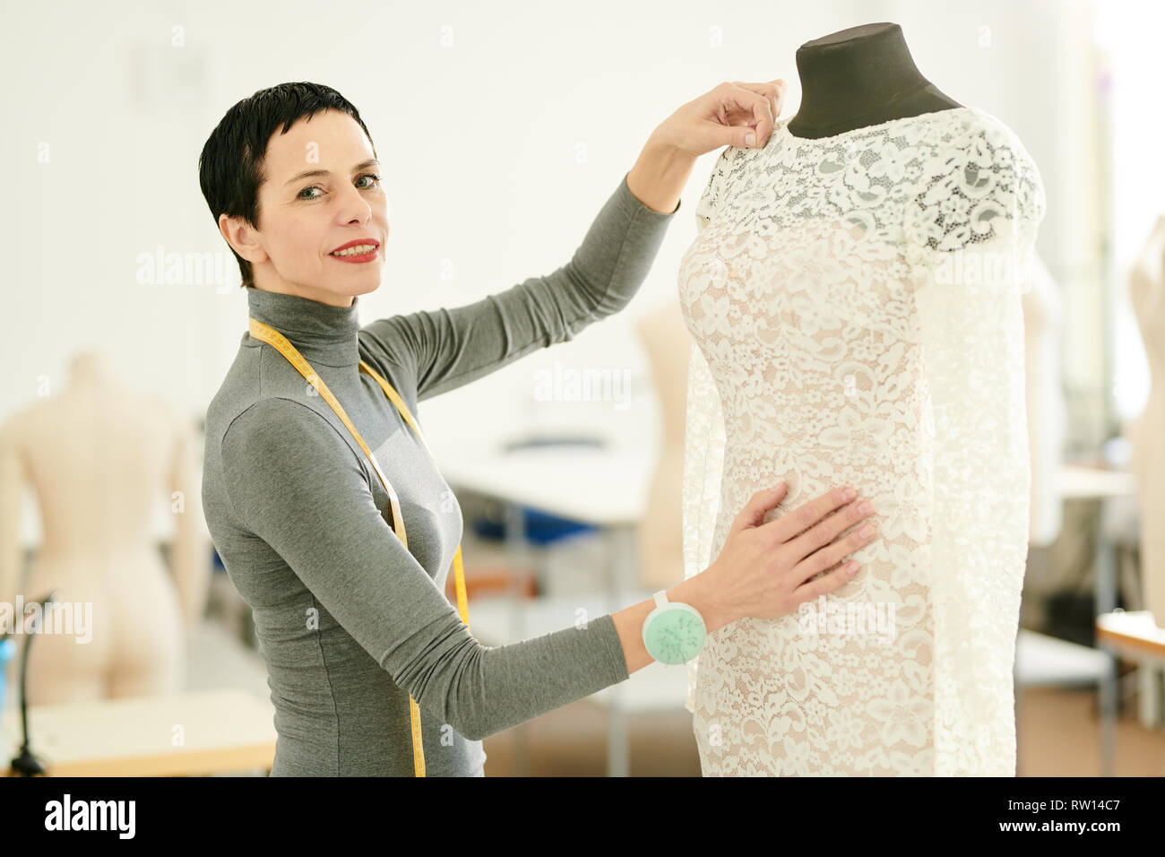 Sewing new dress Stock Photo - Alamy