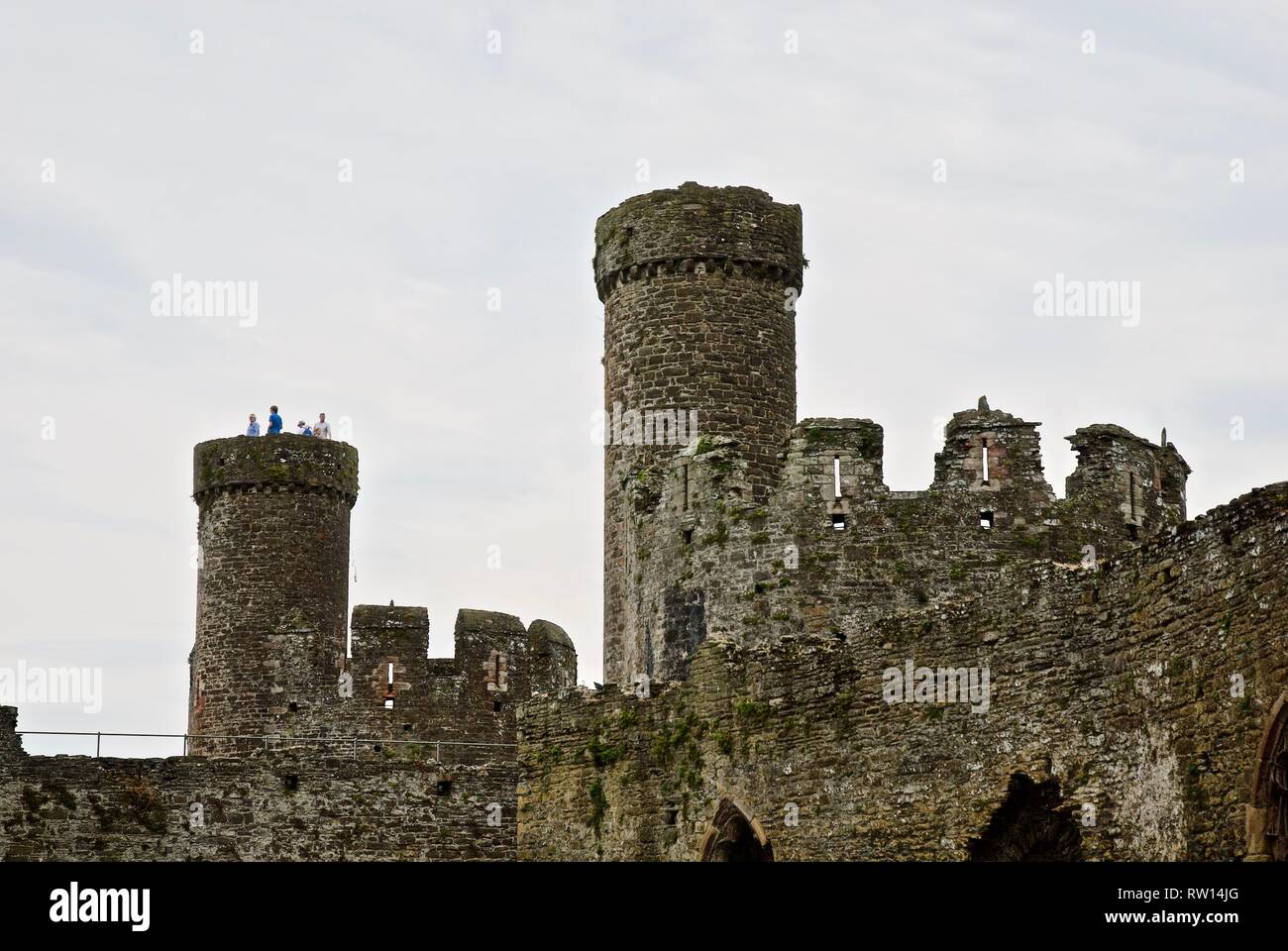 Visitors watch from the top of one of the towers, Conwy Castle, Conwy ...