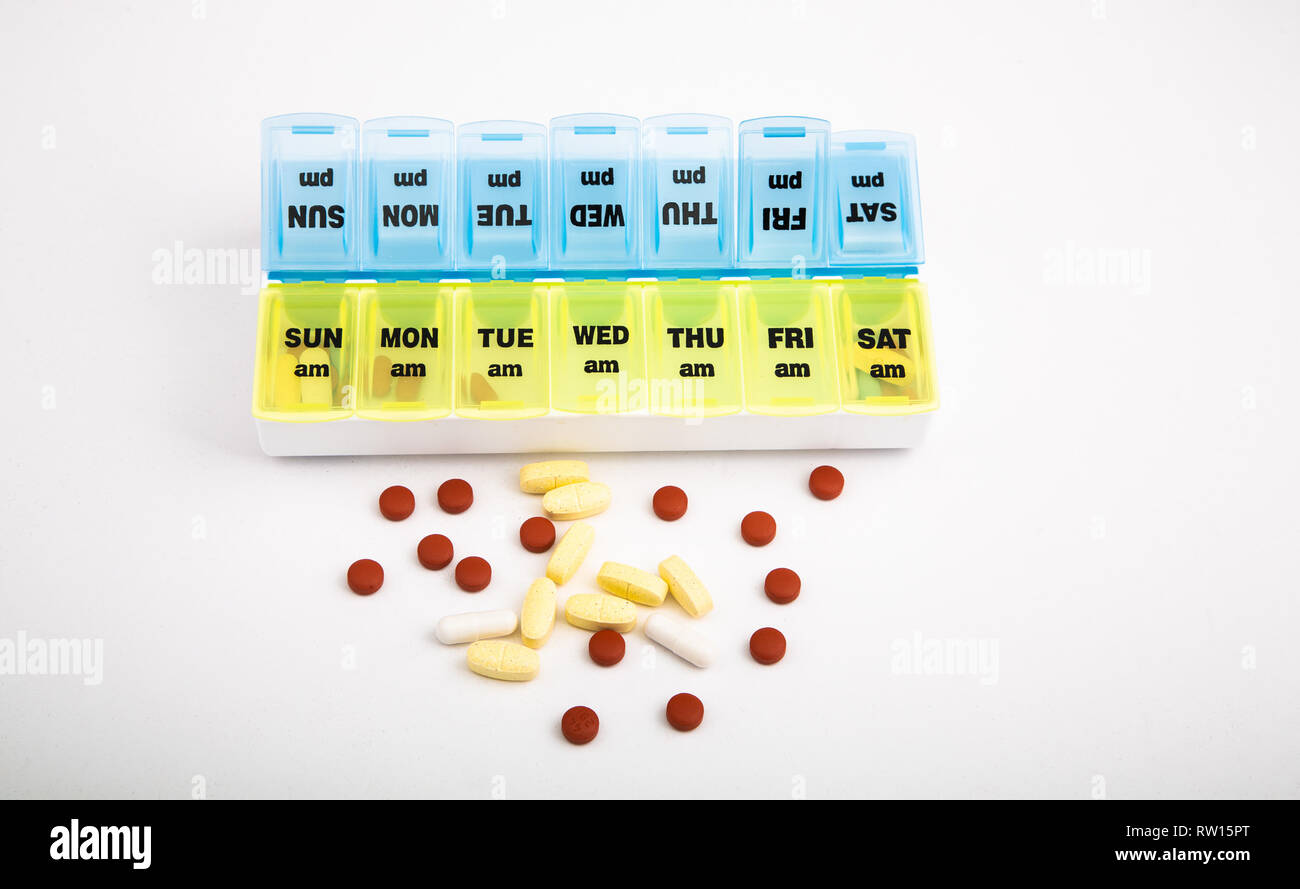 A pill dosage container with markings for morning and night or to use ...