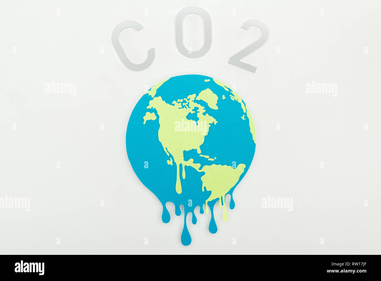 melting paper cut globe and co2 lettering on grey background, global ...