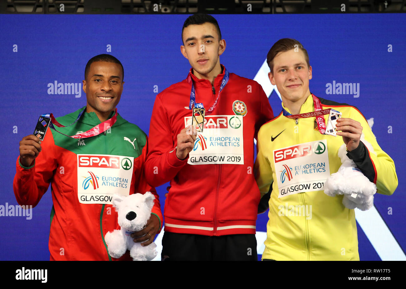 Azerbaijan's Nazim Babayev (centre), Portugal's Nelson Evora (left) and ...
