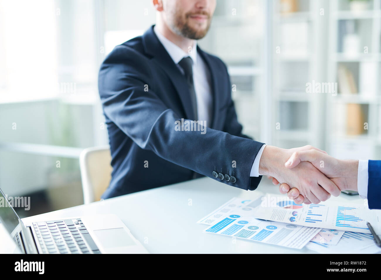 Businessman shaking hands colleague work hi-res stock photography and ...