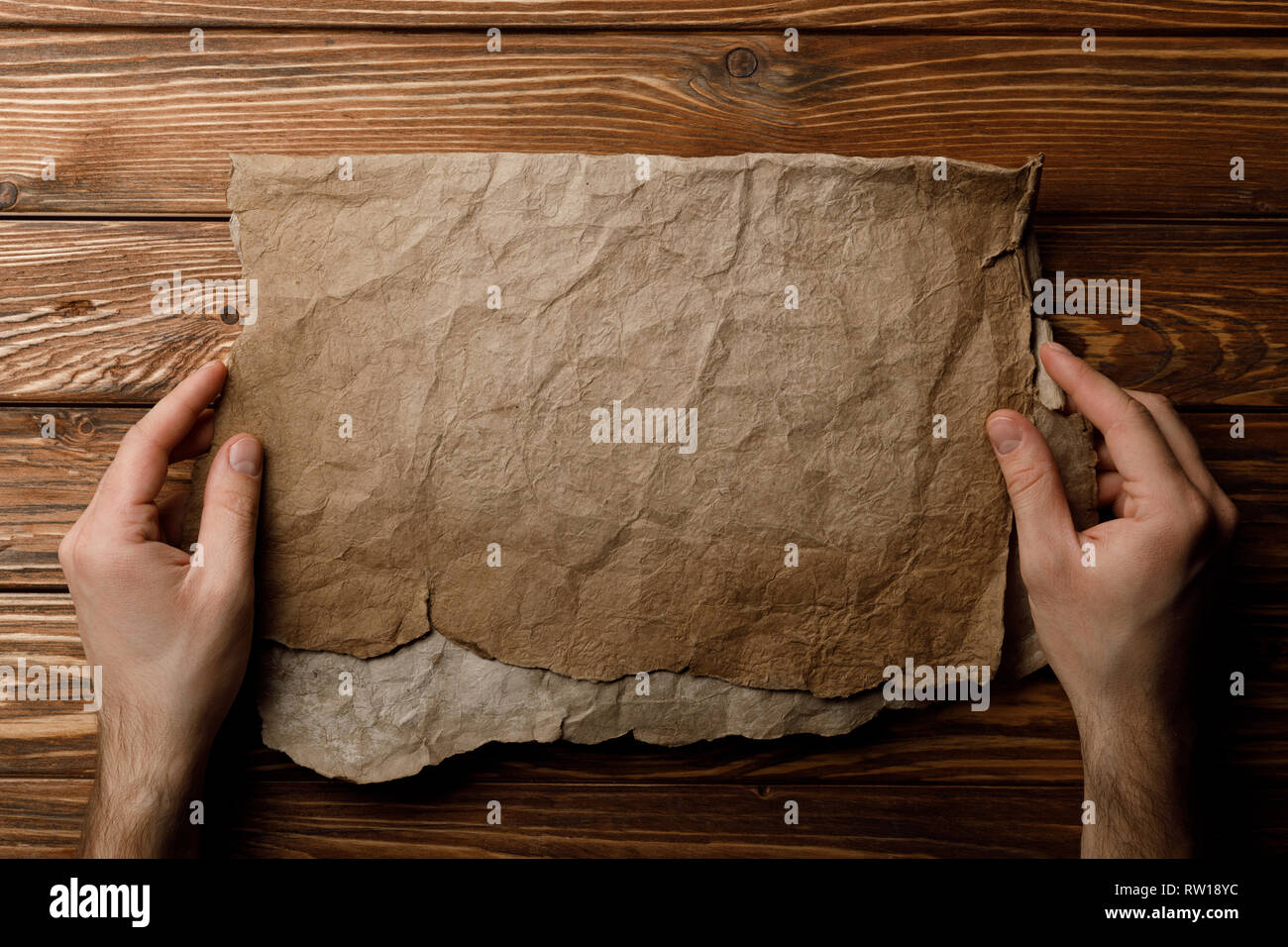 Old man holding sheet of paper hi-res stock photography and images - Alamy