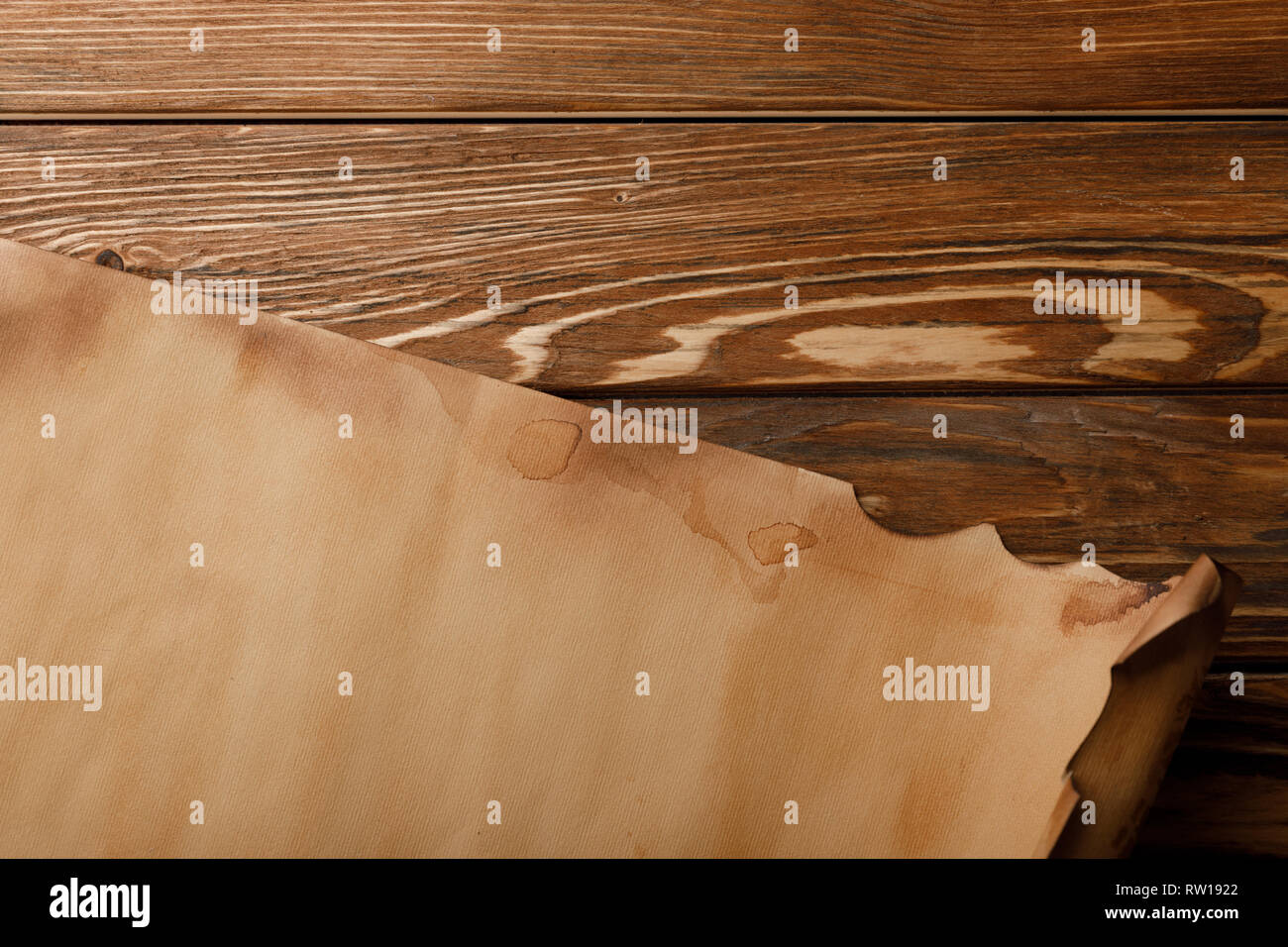 top view of antique parchment sheet lying on wooden background Stock ...