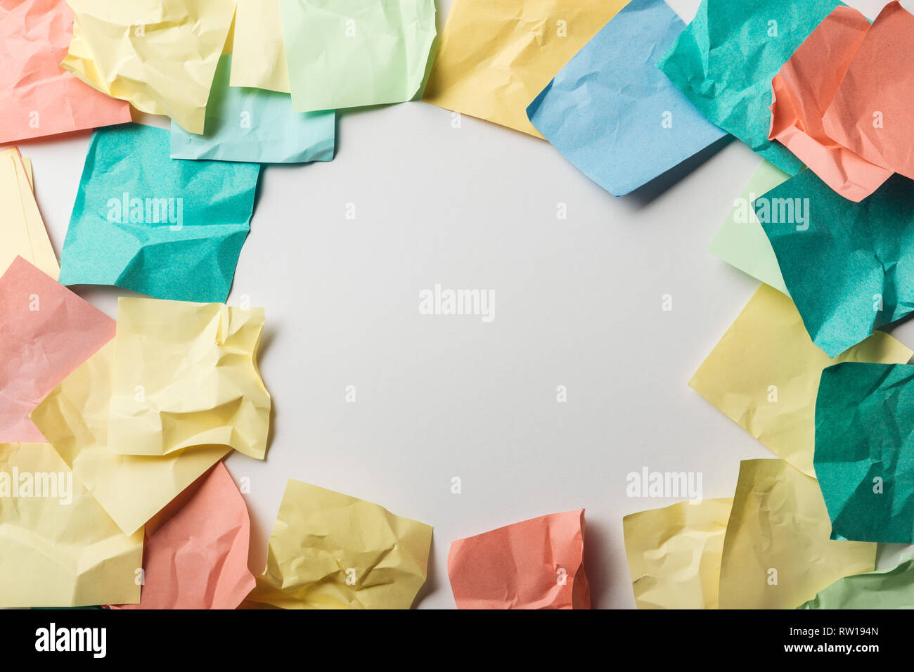 top view of crumpled colorful sticky notes on white background Stock ...