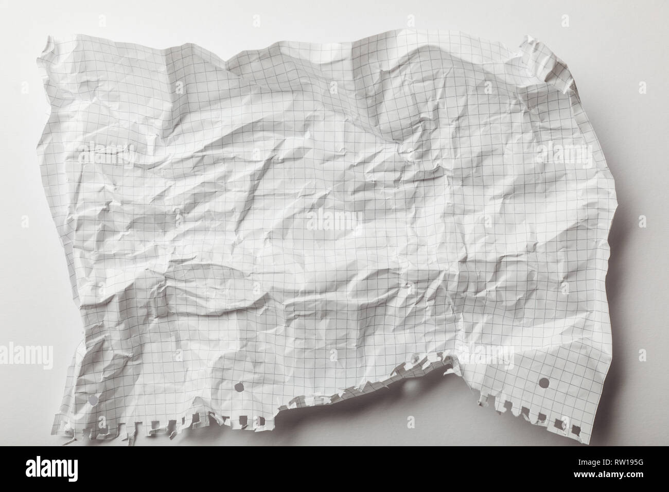 top view of white squared crumpled page on white background Stock Photo ...