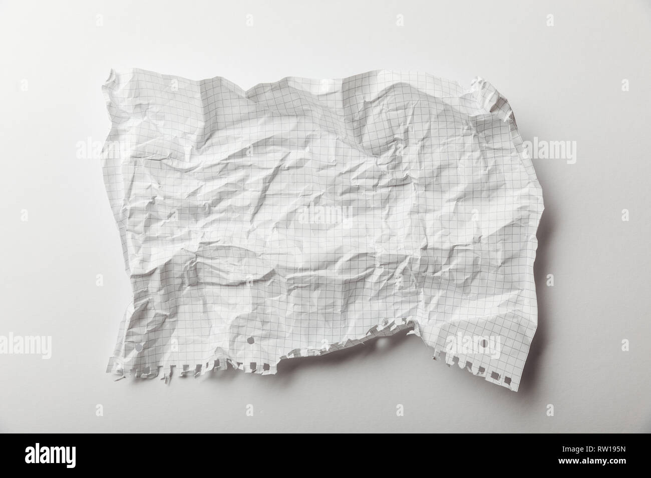 top view of blank squared crumpled page on white background Stock Photo ...