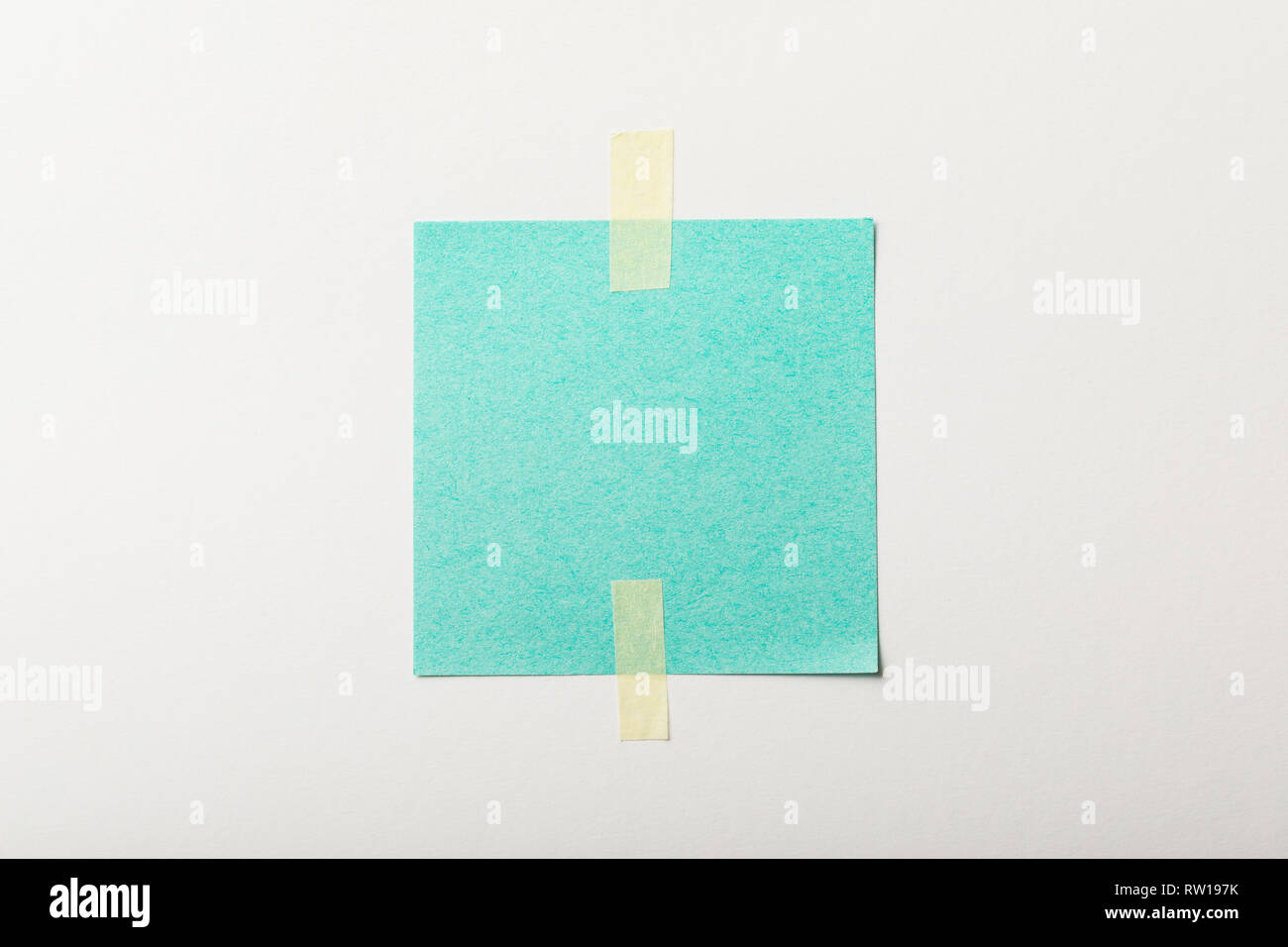 turquoise blank paper with sticky tape on white background Stock Photo ...