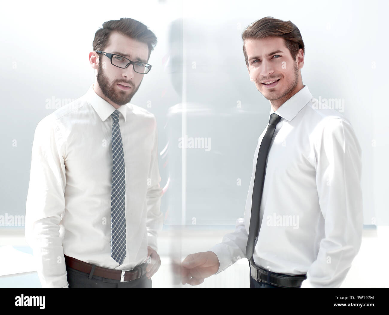 two business people standing in the office Stock Photo - Alamy