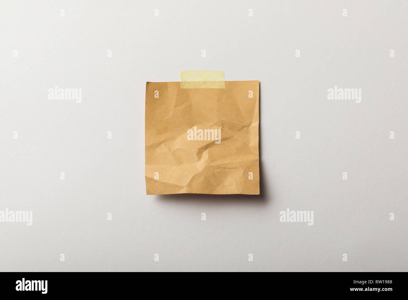 brown blank paper with sticky tape on white background Stock Photo - Alamy