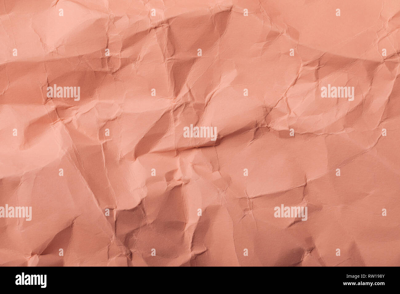 coral blank crumpled page with copy space Stock Photo - Alamy