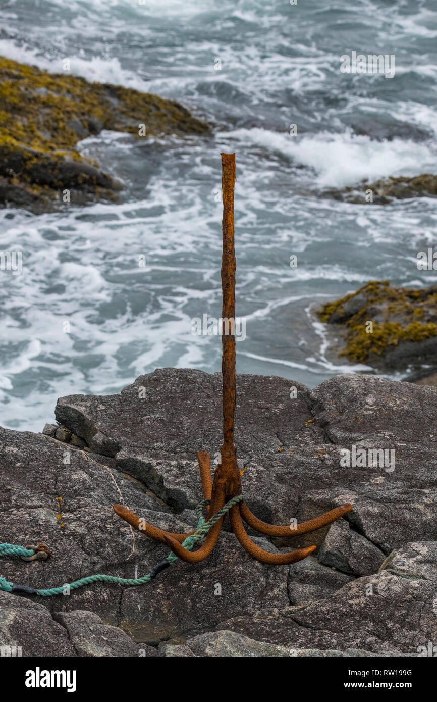 Rusting homemade anchor on the shore at Tilts, Newfoundland, Canada ...