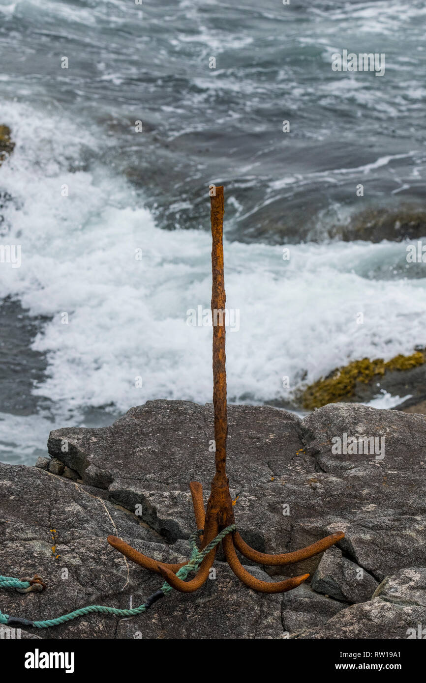 Rusting homemade anchor on the shore at Tilts, Newfoundland, Canada ...