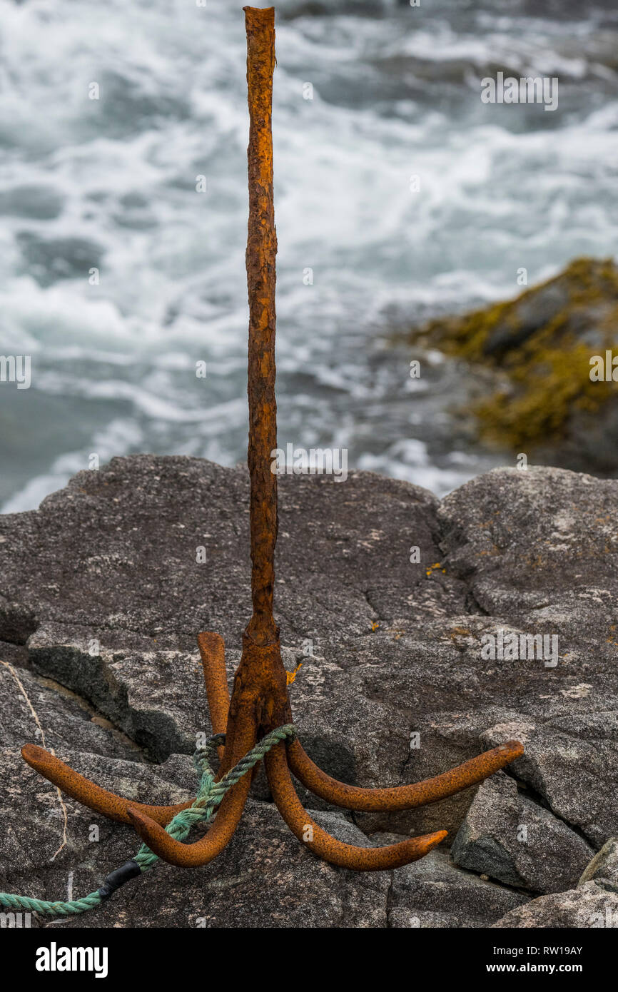 Rusting homemade anchor on the shore at Tilts, Newfoundland, Canada ...