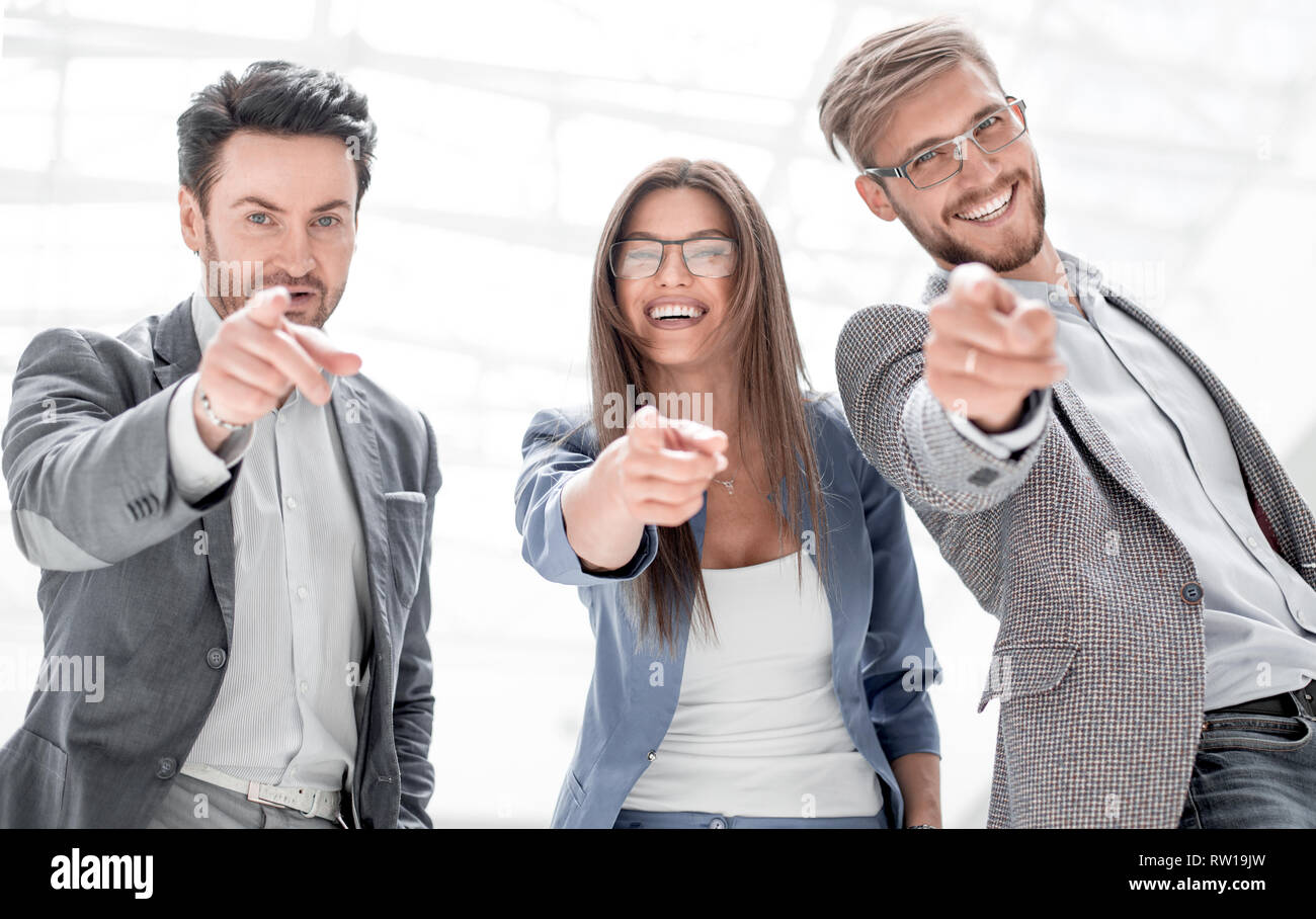 close up.young business people showing up at you Stock Photo - Alamy