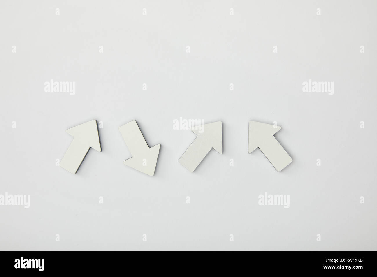 top view of white pointers on grey background Stock Photo - Alamy