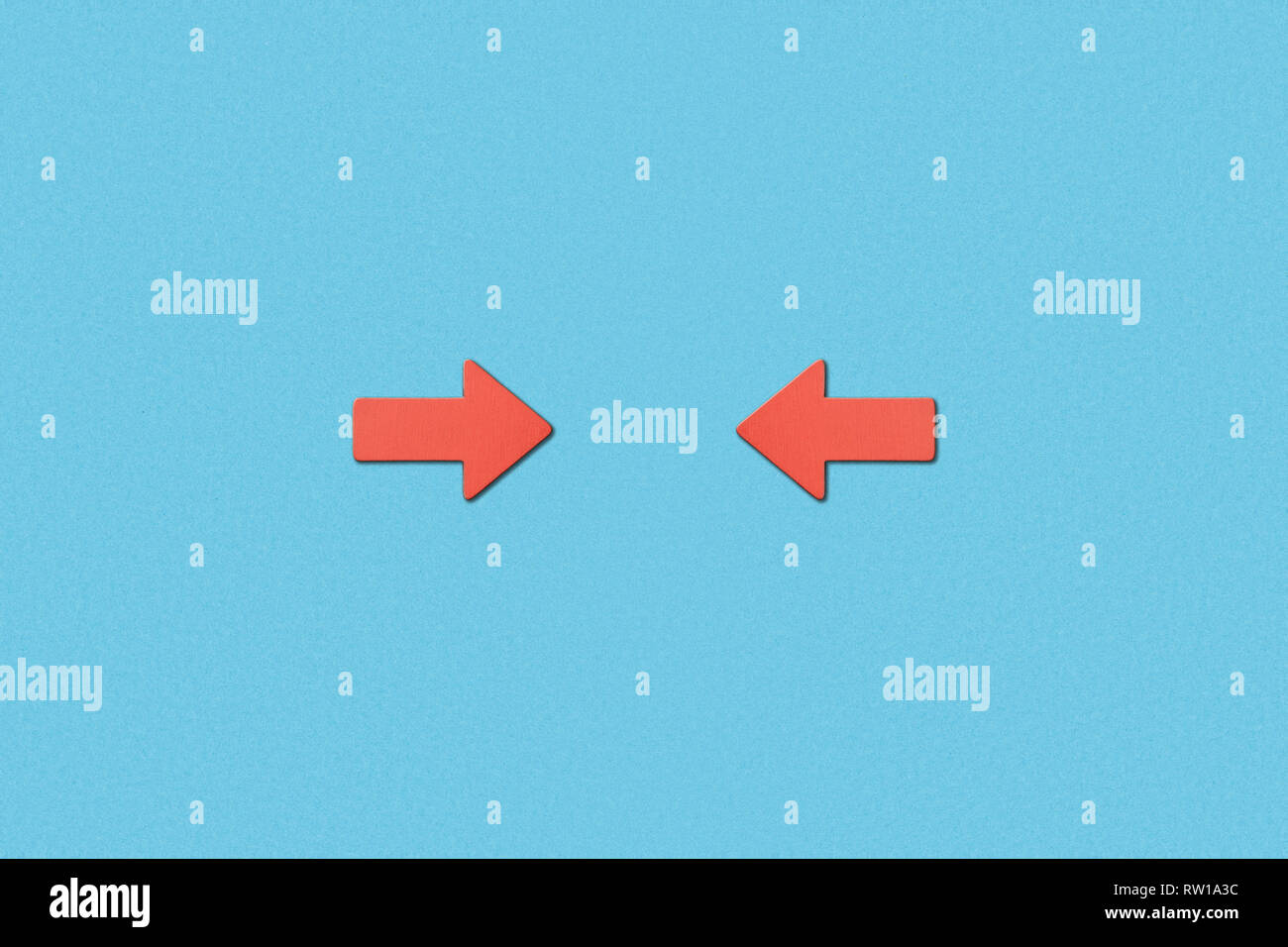 top view of horizontal opposite red pointers on blue background Stock ...