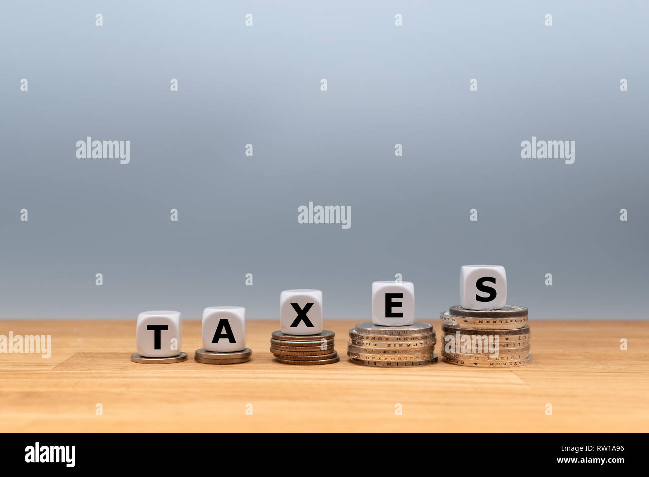 Symbol for increasing tax returns. Dice on top of increasing high ...