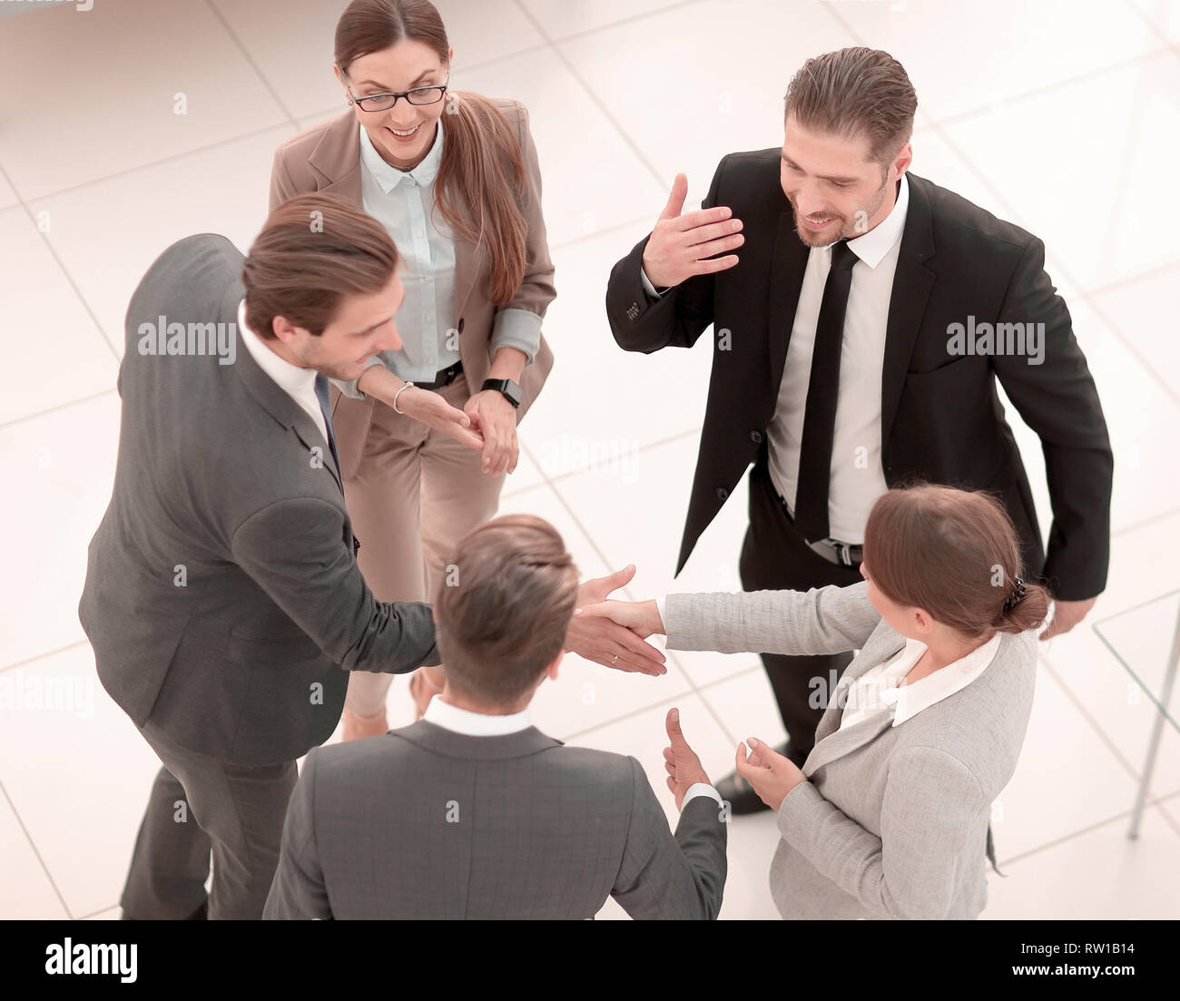 top view.handshake trading partners in the office Stock Photo - Alamy