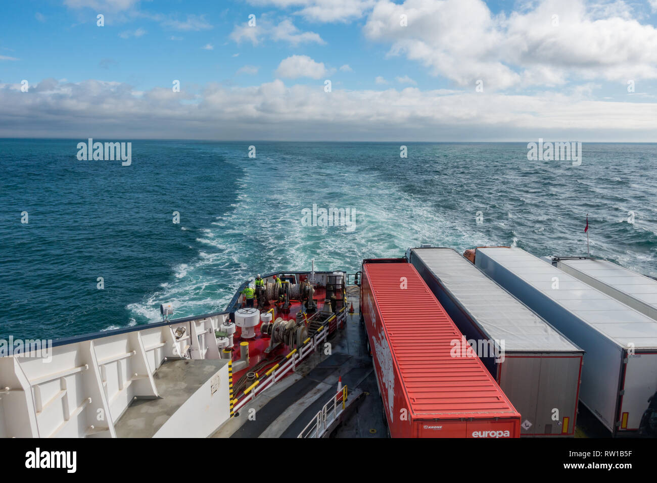 DFDS Ferry at sea with container lorries on the open deck. Dover, Kent ...