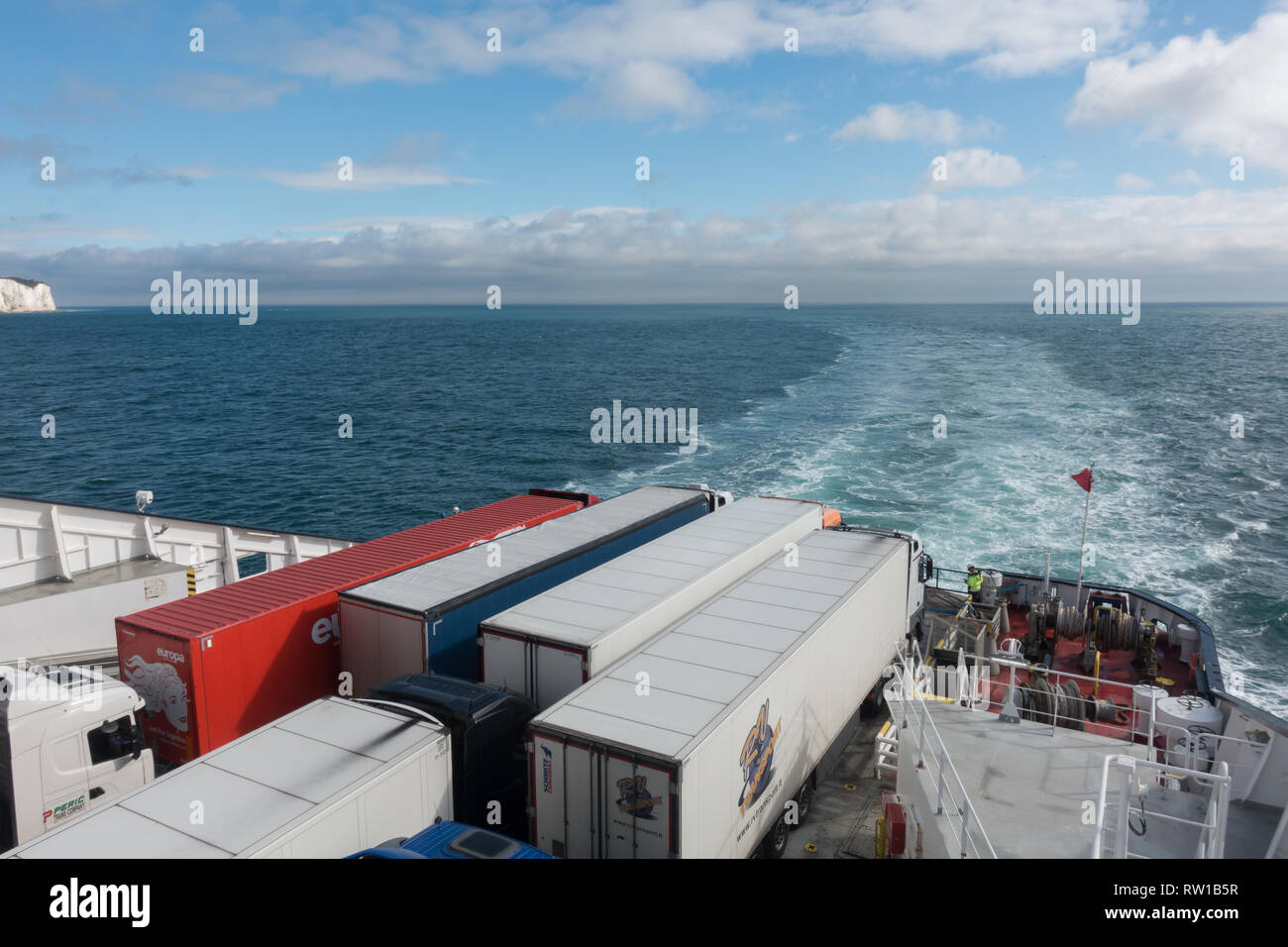 DFDS Ferry at sea with container lorries on the open deck. Dover, Kent ...
