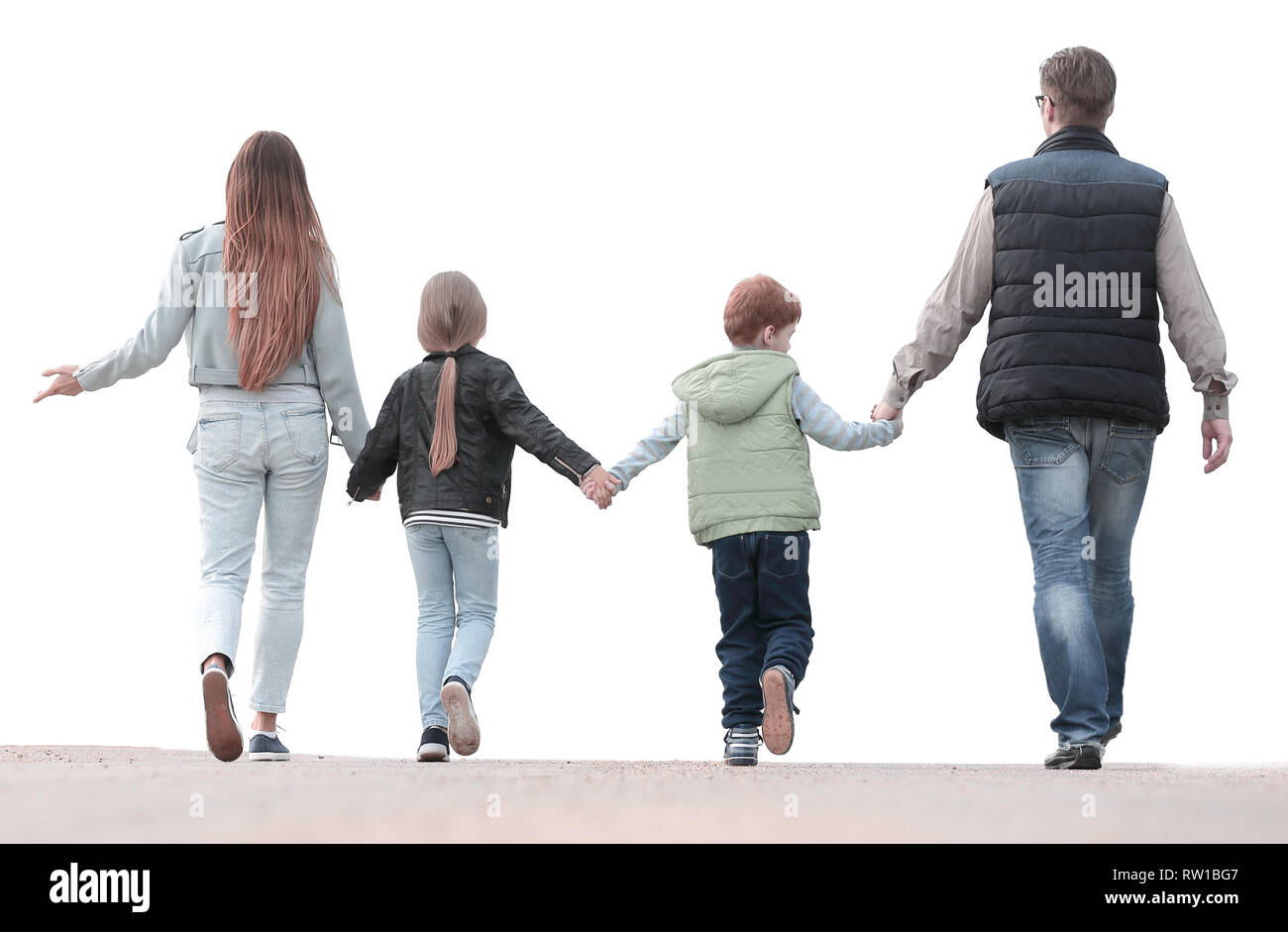 rear view . a happy family goes forward Stock Photo - Alamy