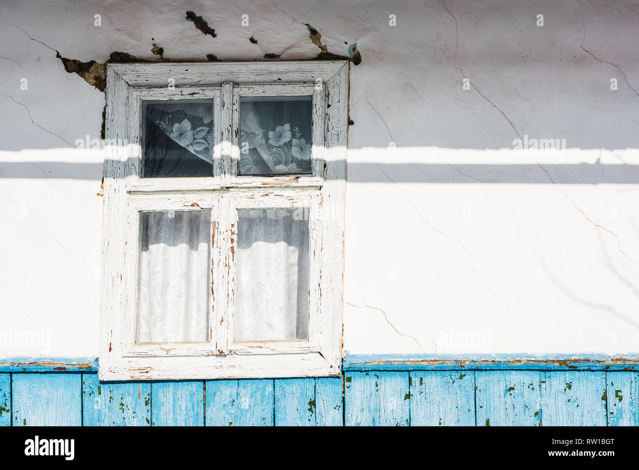 old weathered house with window, cracks and sunshine Stock Photo - Alamy