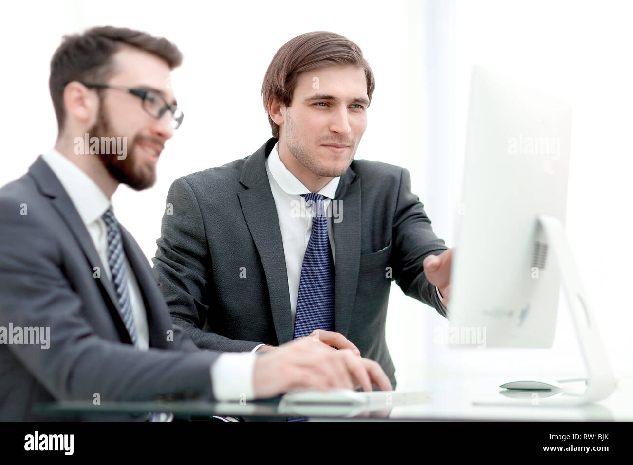 colleagues are discussing new data, sitting at a Desk Stock Photo - Alamy