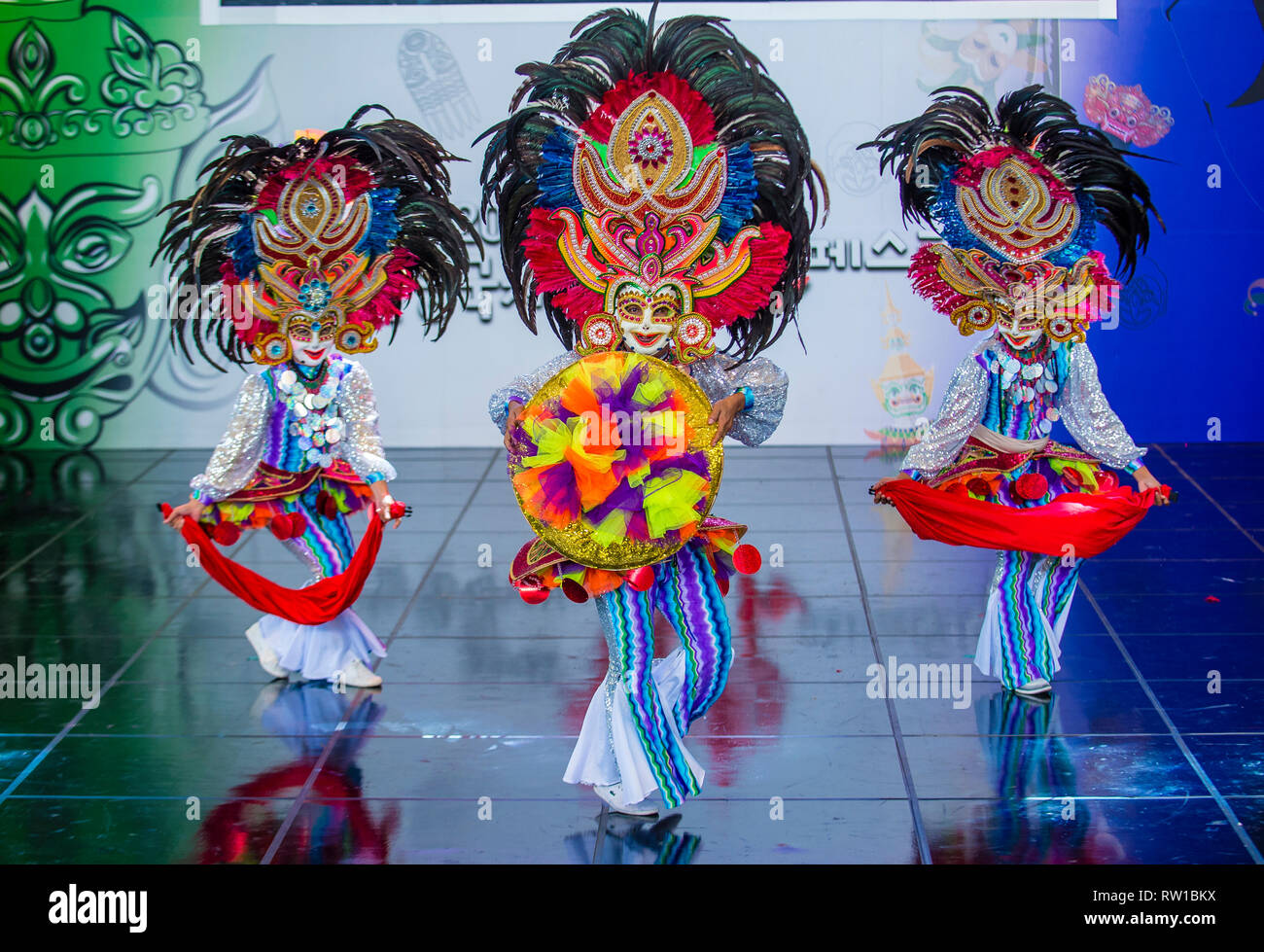 Filipino dancers from the Masskara festival of Bacolod perform at the ...