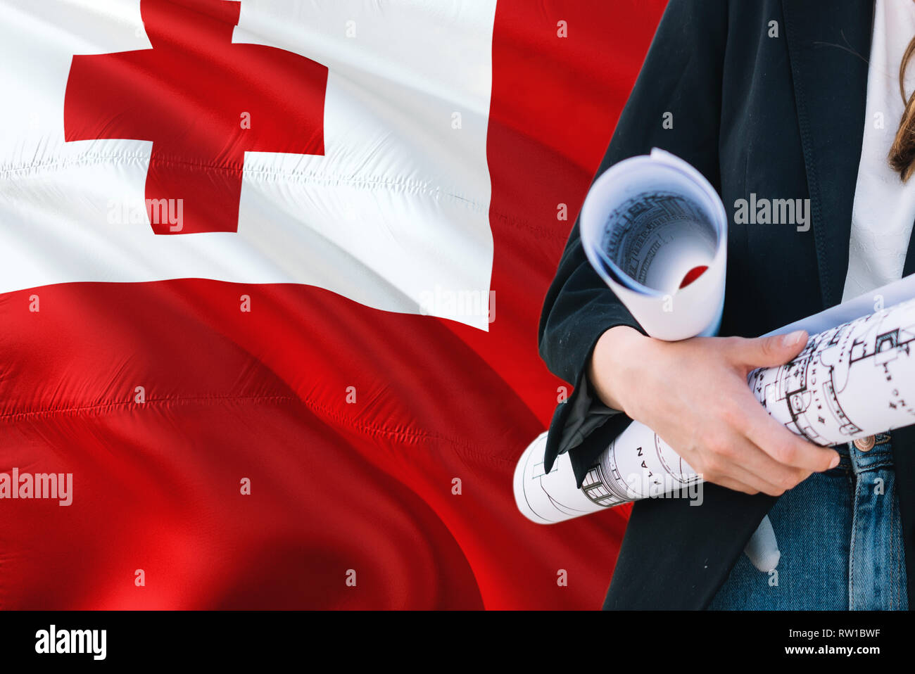 Tongan Architect woman holding blueprint against Tonga waving flag ...