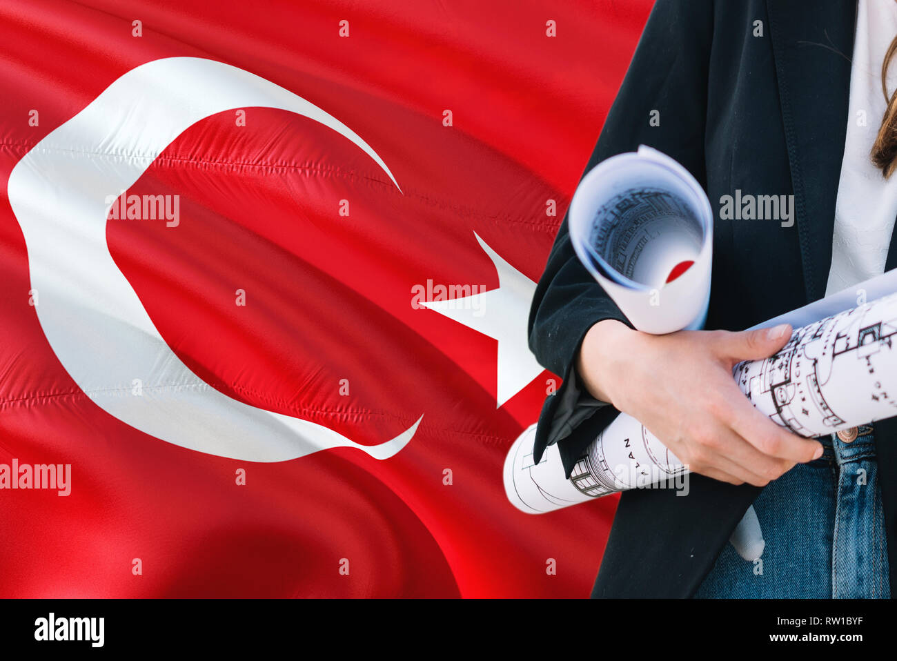 Turkish Architect woman holding blueprint against Turkey waving flag ...