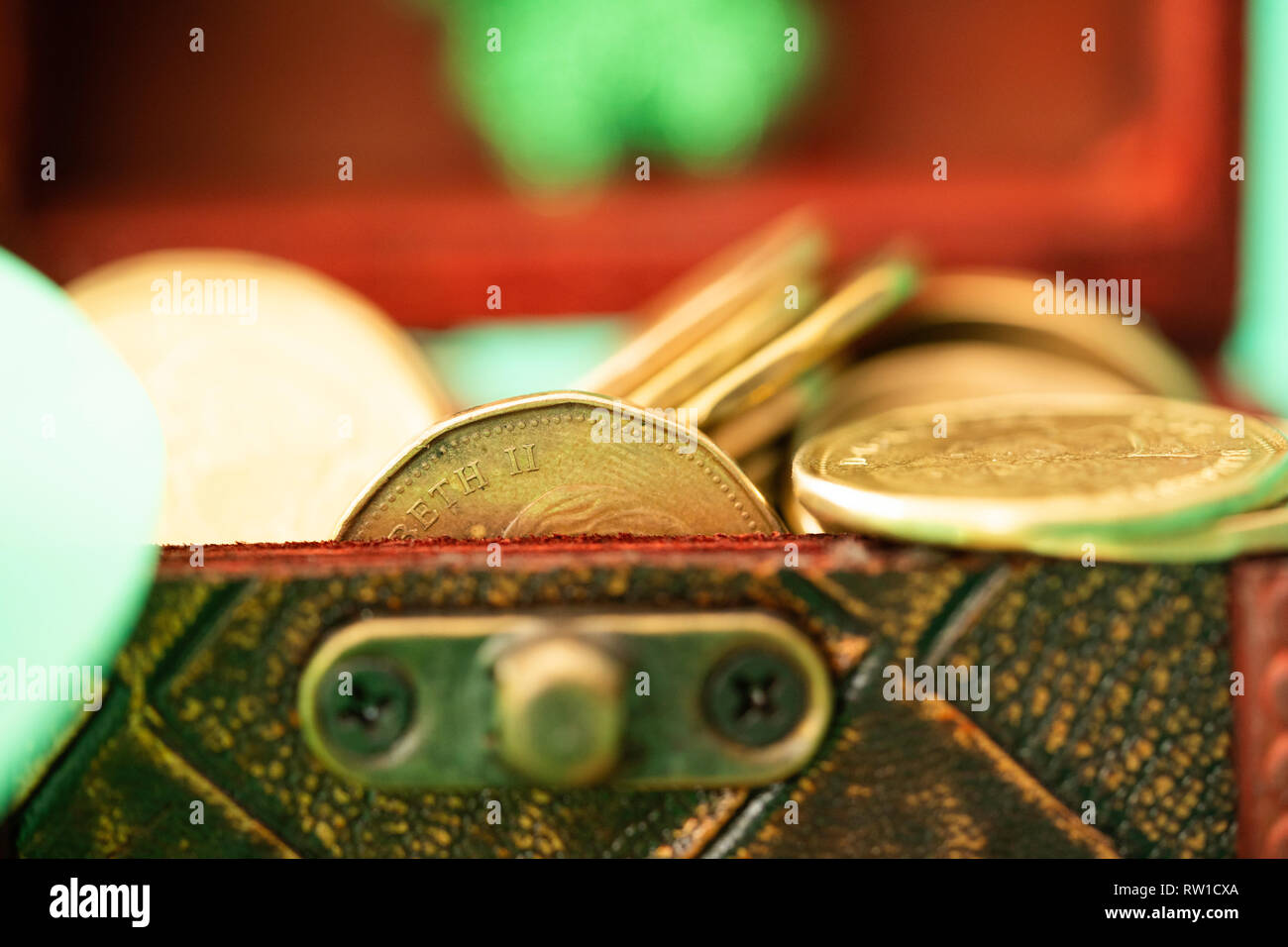 Close up cash coins in treasure chest Stock Photo - Alamy