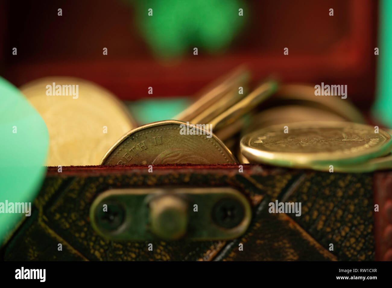 Close up cash coins in treasure chest Stock Photo - Alamy