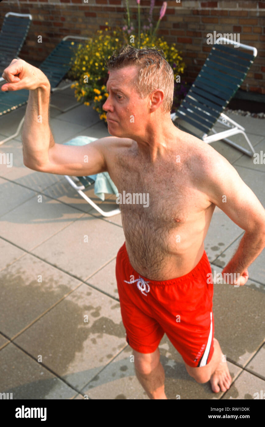 Man flexing muscles hi-res stock photography and images - Alamy