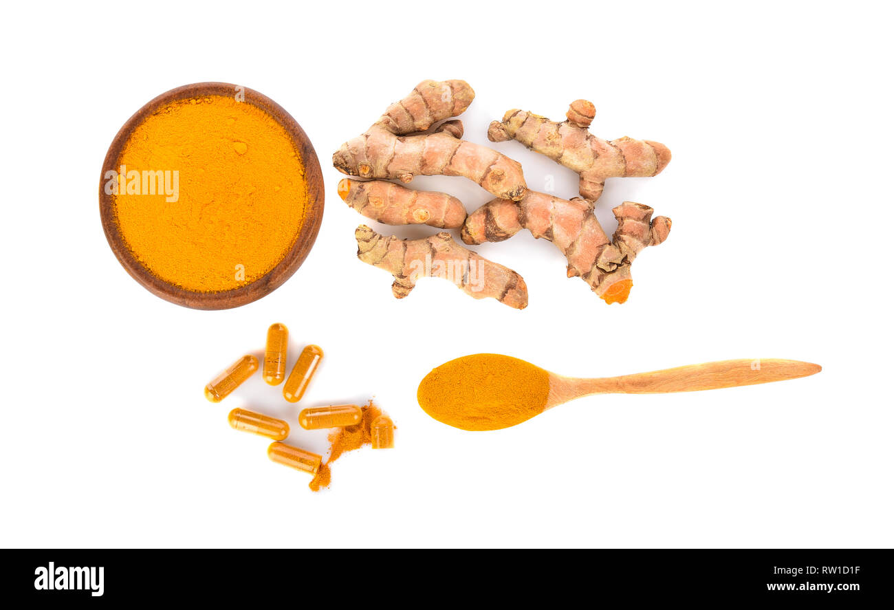 Top view of Turmeric Capsule ,Turmeric in wooden spoon and turmeric in ...