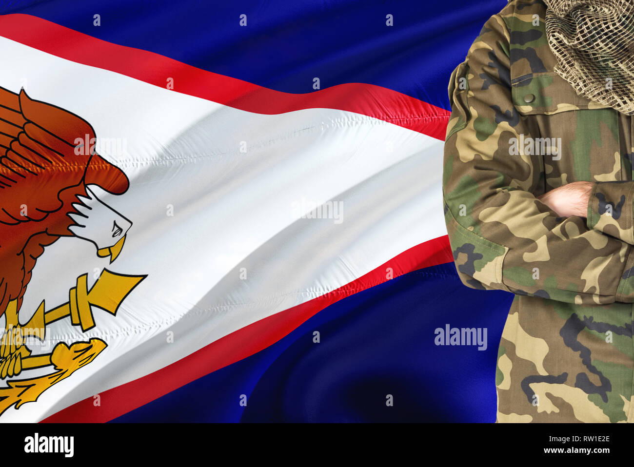 Crossed arms soldier with national waving flag on background - American ...