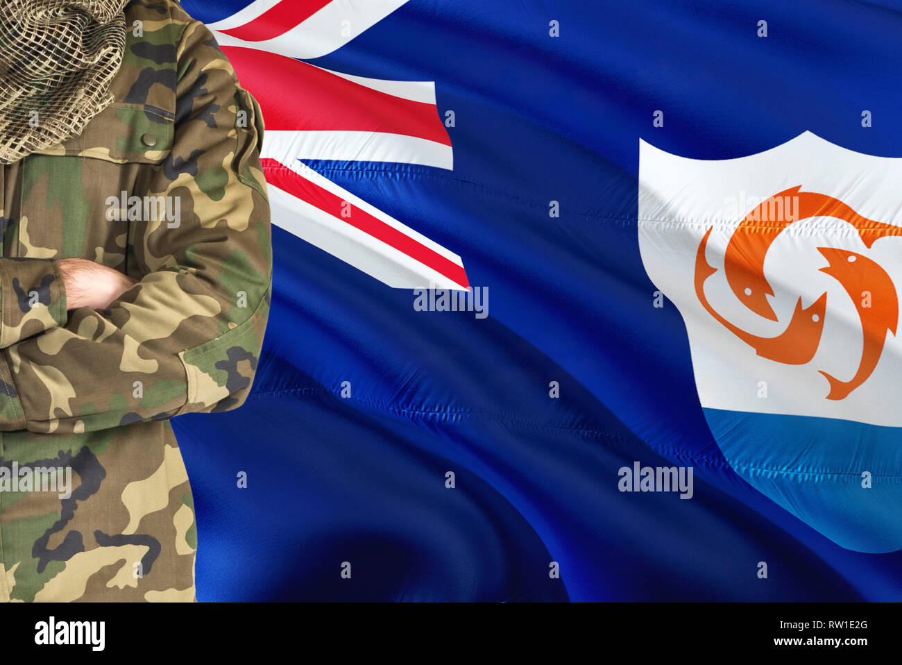 Crossed arms Anguilla soldier with national waving flag on background ...
