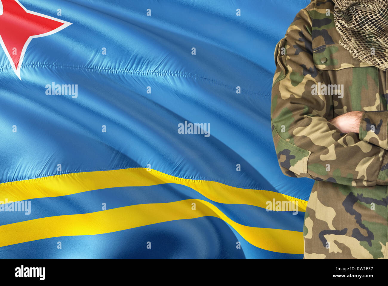 Crossed arms soldier with national waving flag on background - Aruba ...