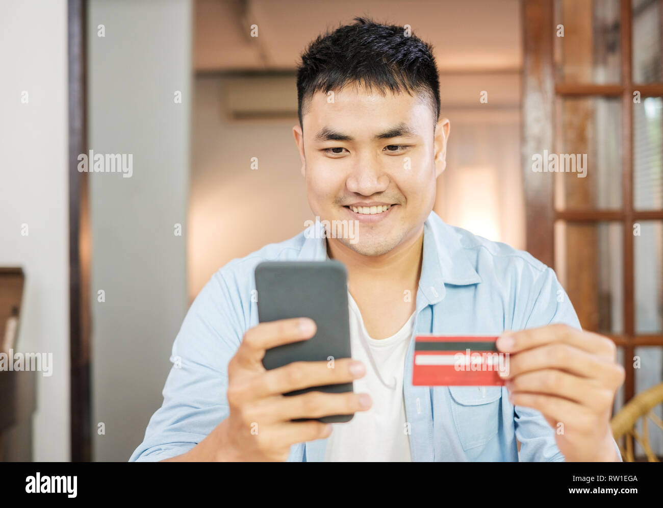 Asian male consumer hi-res stock photography and images - Alamy