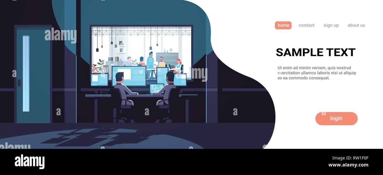 two men looking at monitors sitting behind glass window people working ...