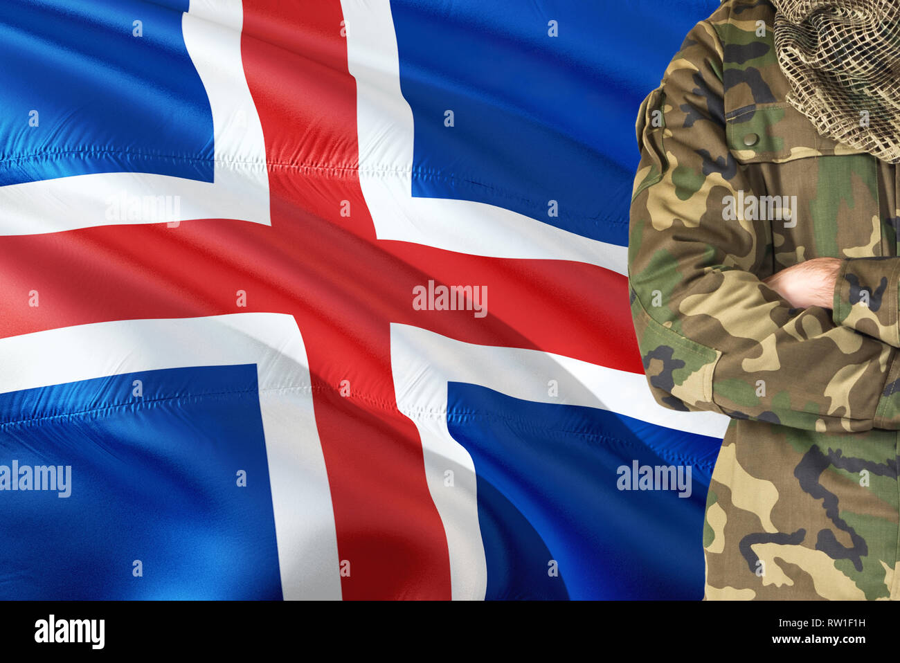 Crossed arms soldier with national waving flag on background - Iceland ...